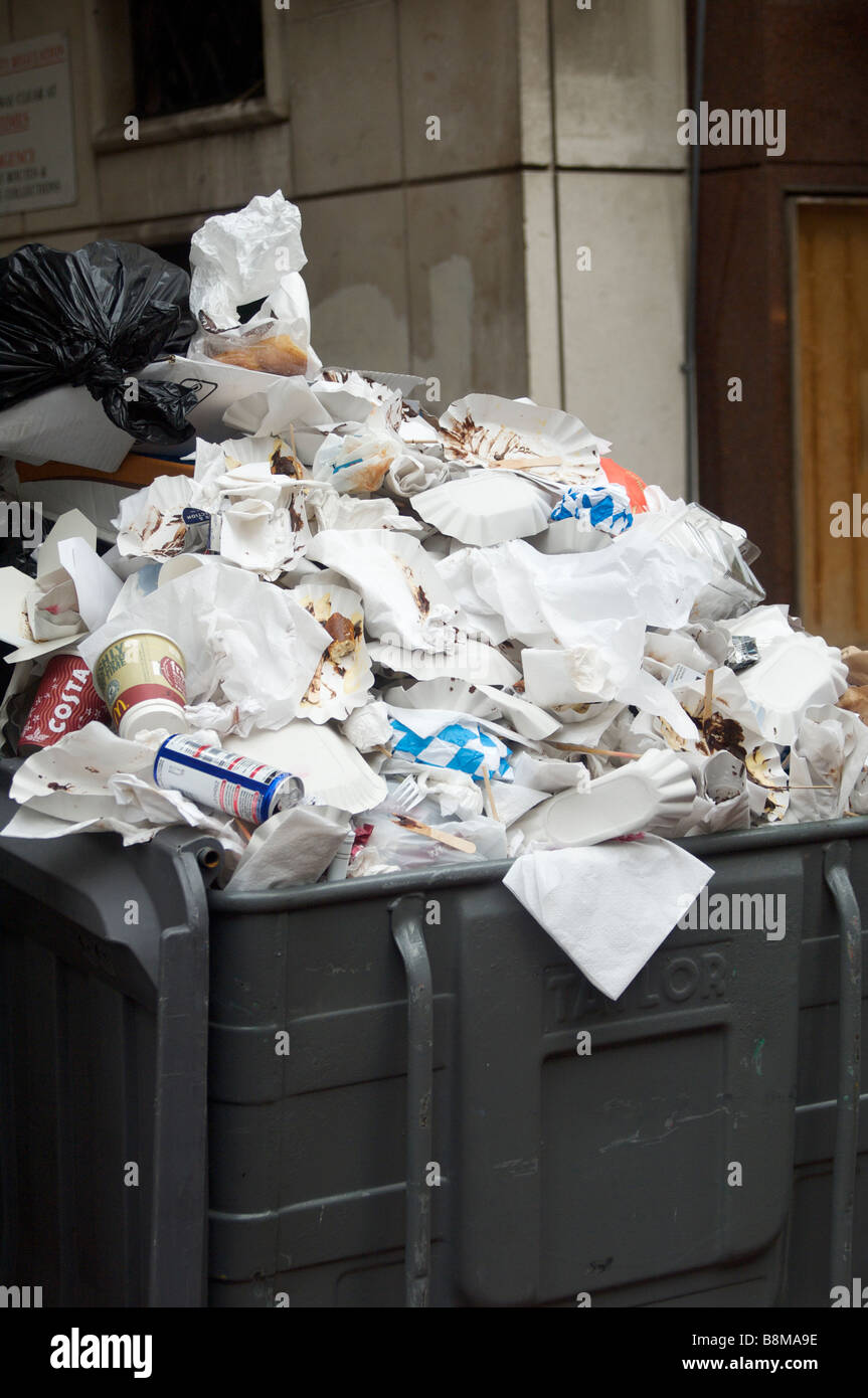 Full rubbish bin full of street rubbish Stock Photo - Alamy