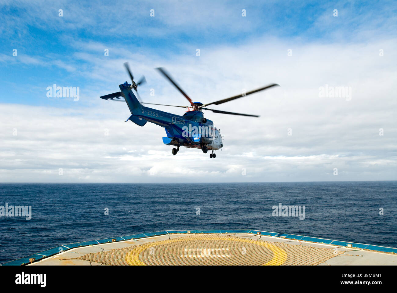 photograph of eurocopter ec225 hovering above helipad offshore Stock ...