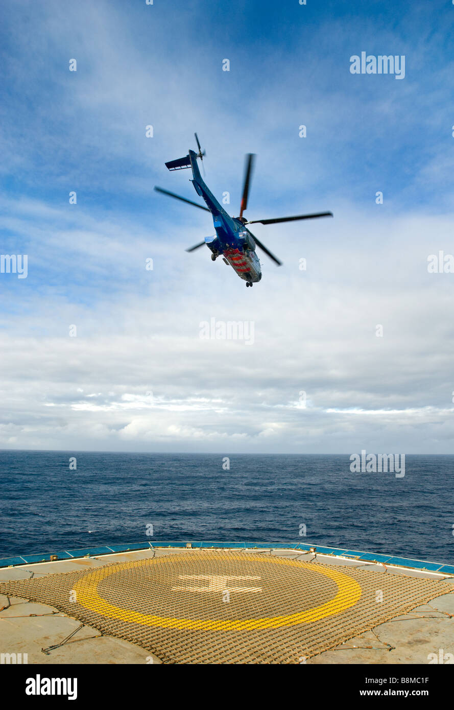 photograph of eurocopter ec225 hovering above helipad offshore Stock ...