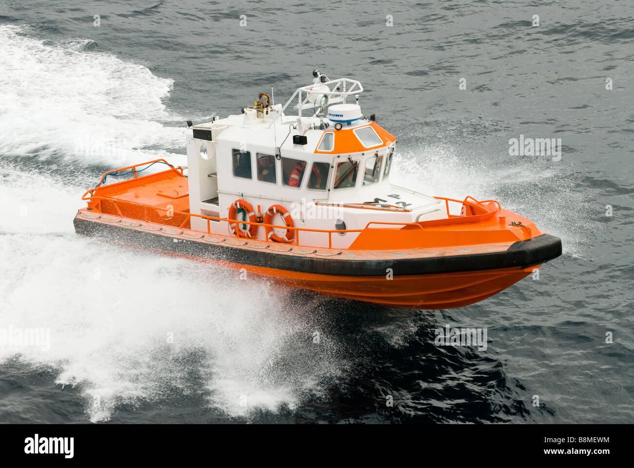 photograph of fast rescue boat traveling at speed Stock Photo - Alamy