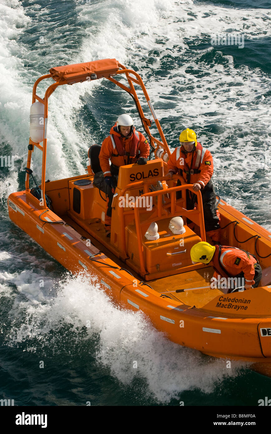 photograph of fast rescue boat rib under way Stock Photo - Alamy