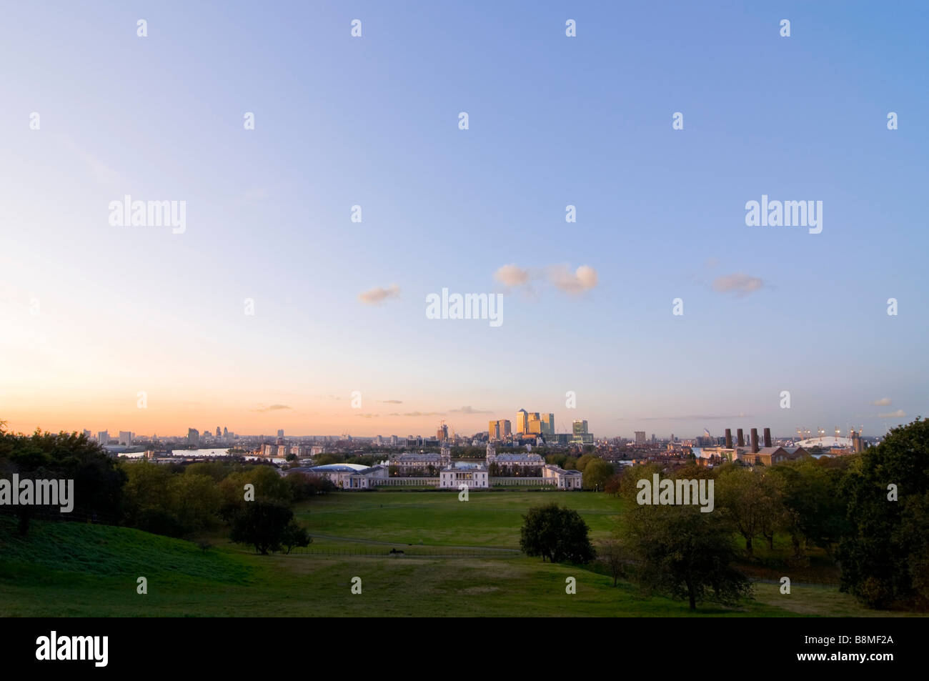 Horizontal wide angle of Greenwich Park at sunset with many landmarks ...