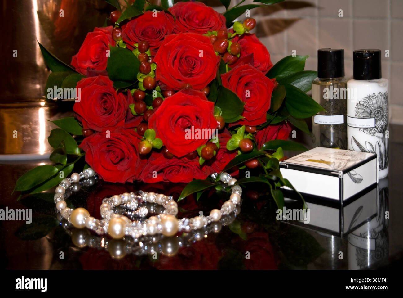 Horizontal close up of a bouquet of a dozen beautiful red roses and ...