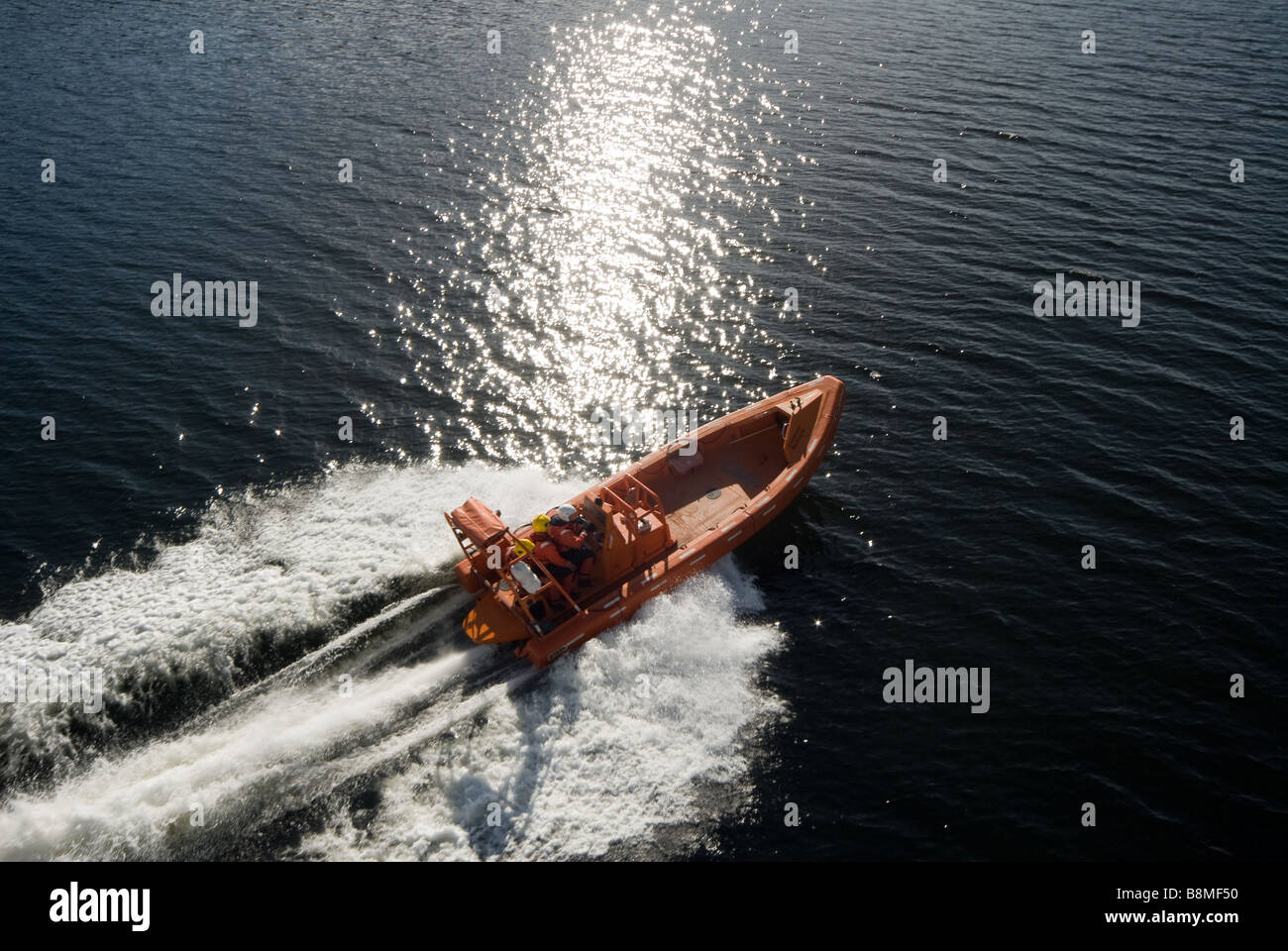 photograph of fast rescue boat rib under way Stock Photo - Alamy