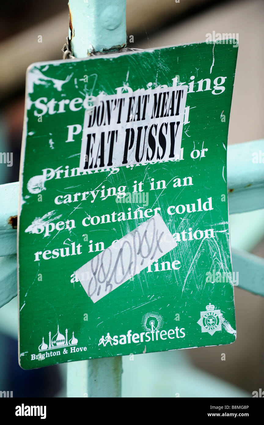 A defaced safer streets sign on Brighton beach Stock Photo - Alamy