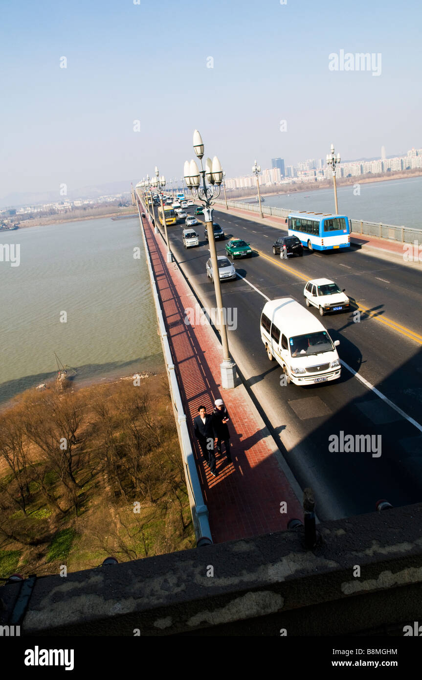 People Vehicles and trains on the first bridge over the Yangtze river ...