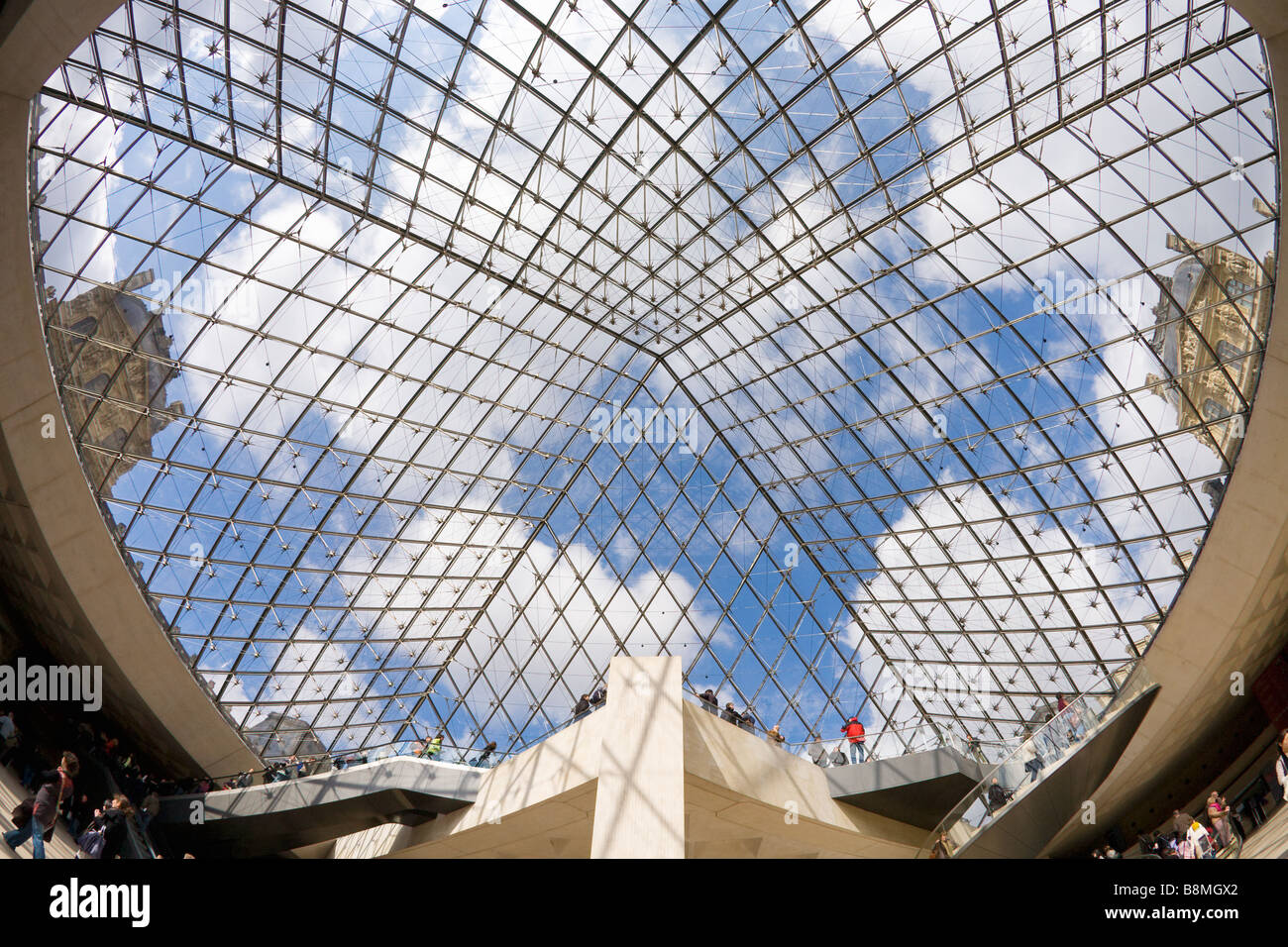Musee du Louvre Museum interior of Pyramide in spring sunshine Paris ...