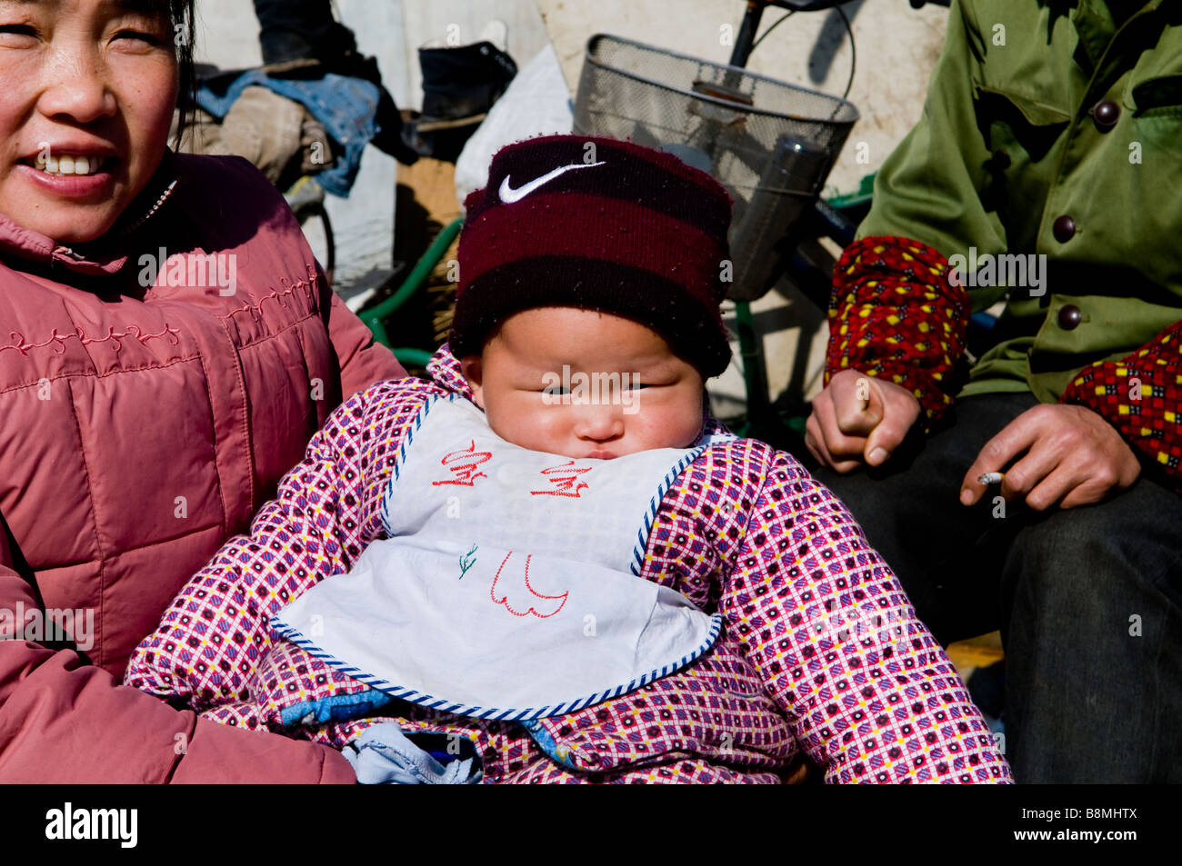 Cute Chinese baby dressed in bulky winter cloth Stock Photo - Alamy