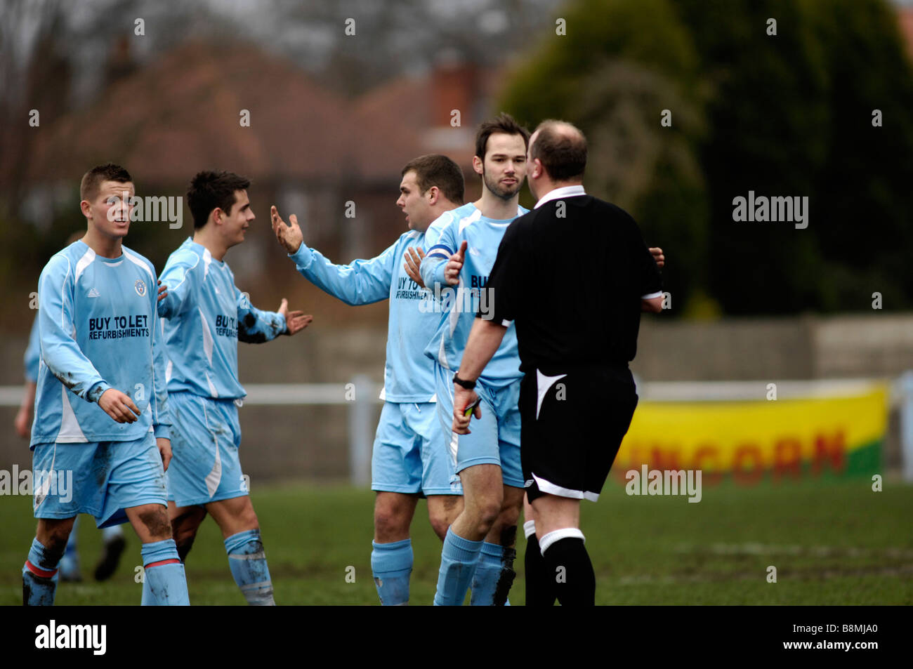 footballers complain about referee's decision Stock Photo - Alamy
