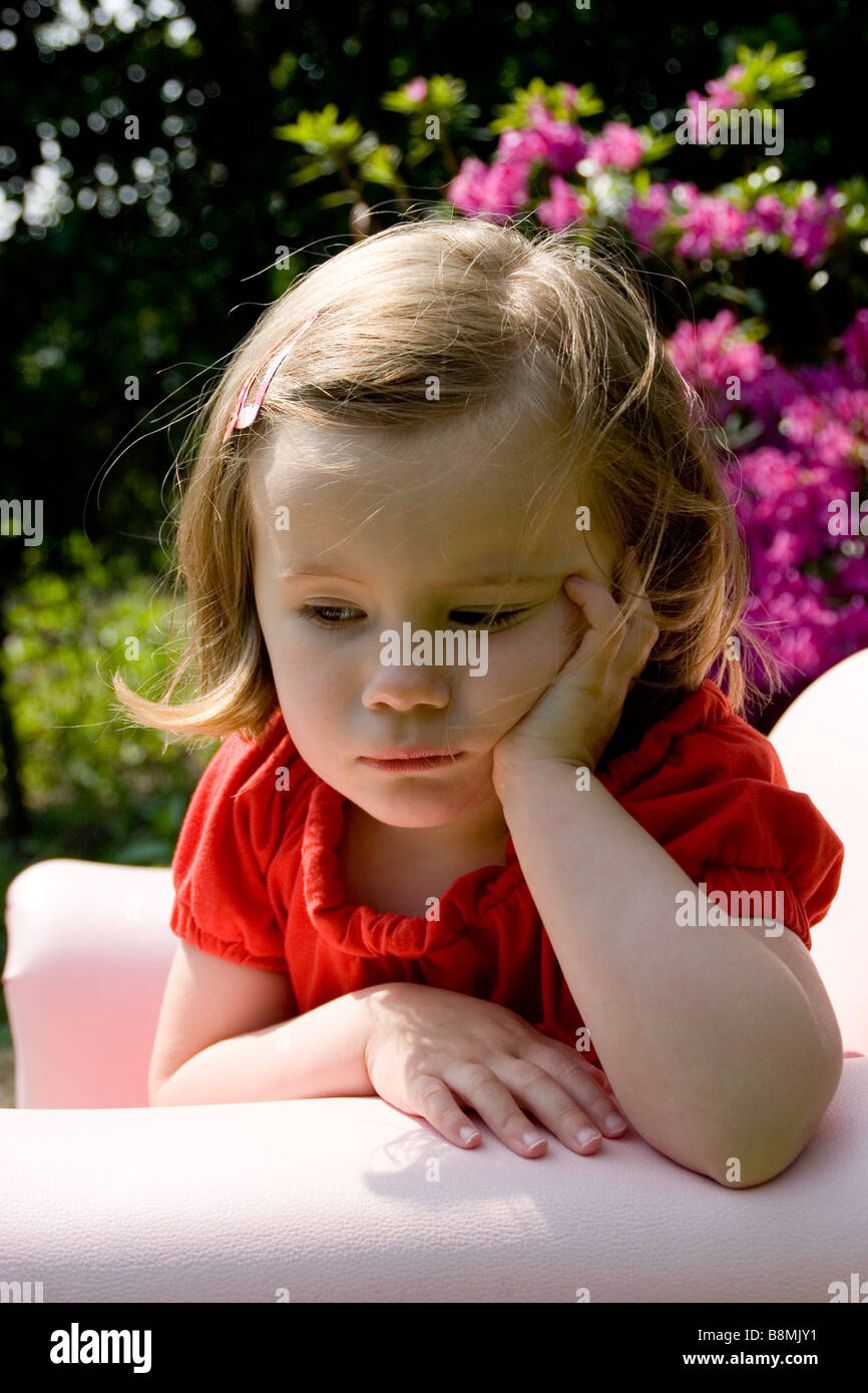 young child head in hands deep in thought Stock Photo - Alamy