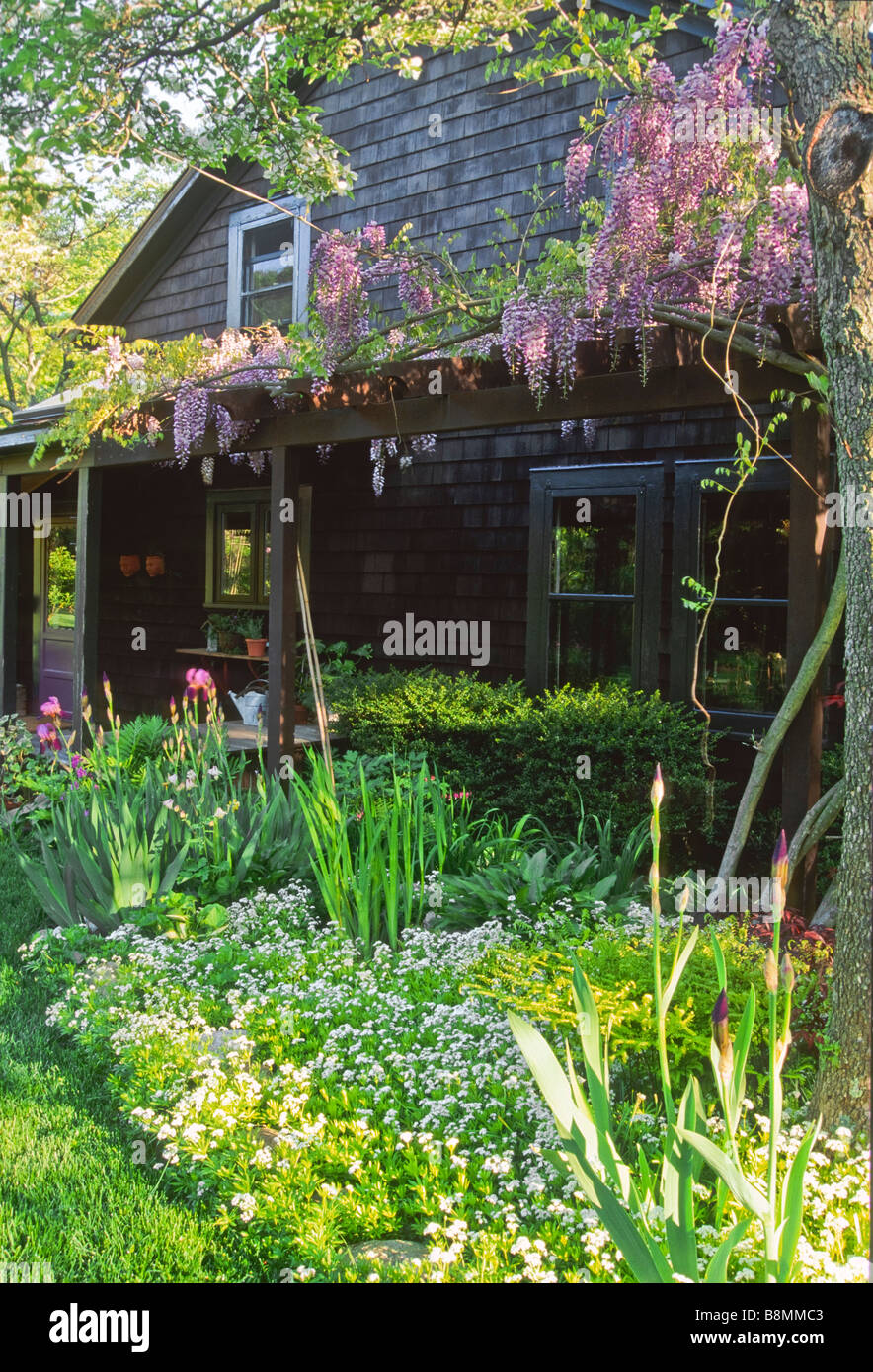 A country cottage garden in spring with farmhouse Stock Photo - Alamy