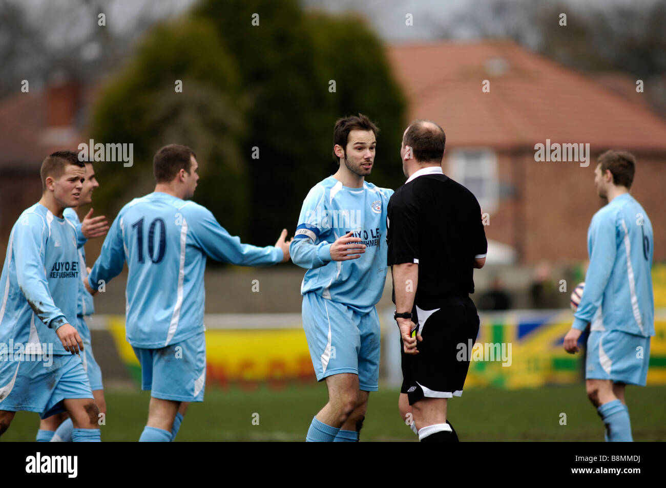 footballers complain about referee's decision Stock Photo - Alamy