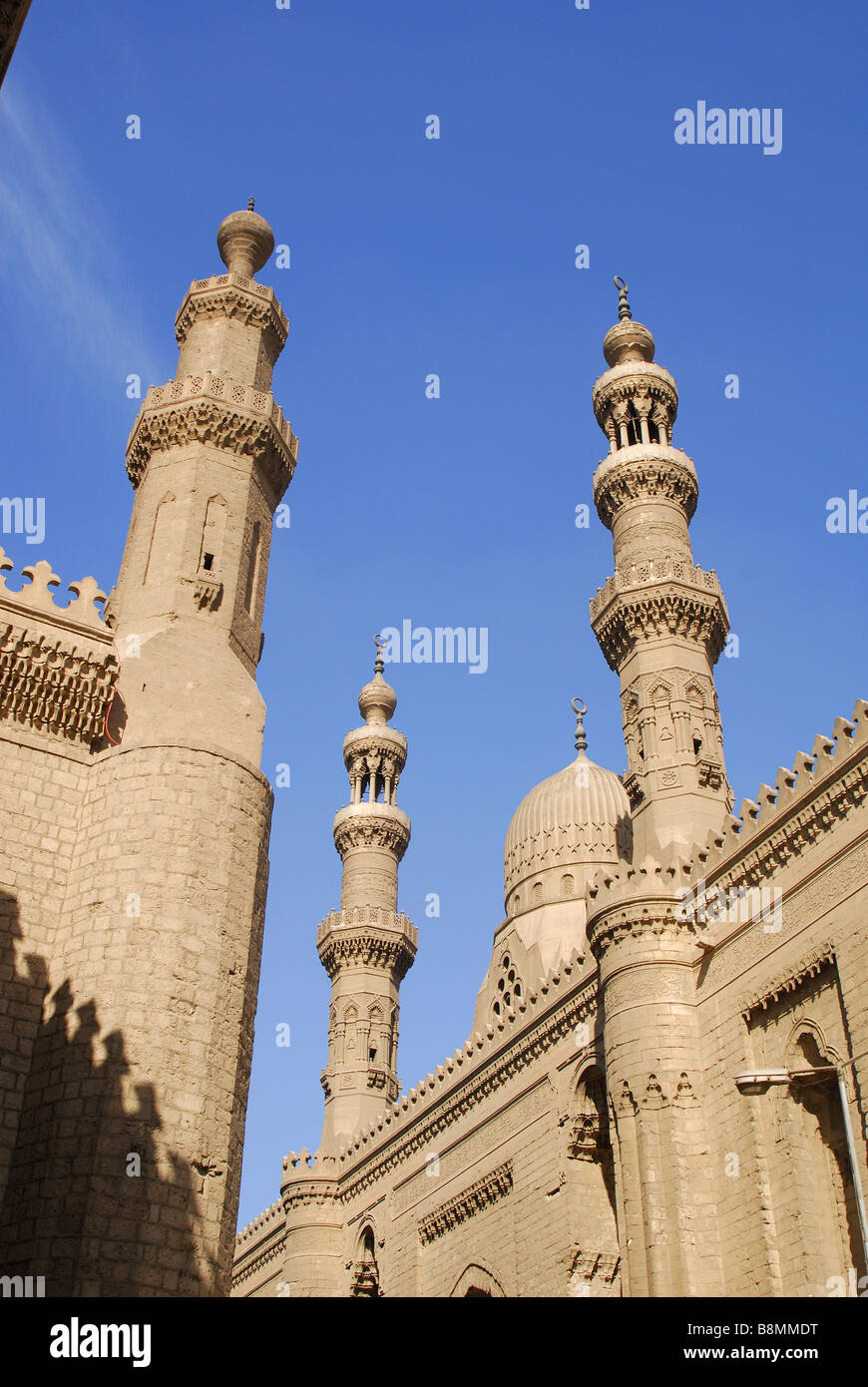 CAIRO, EGYPT. Looking up at the minarets of the Mosque of Sultan Hassan and the Rifai Mosque by ...