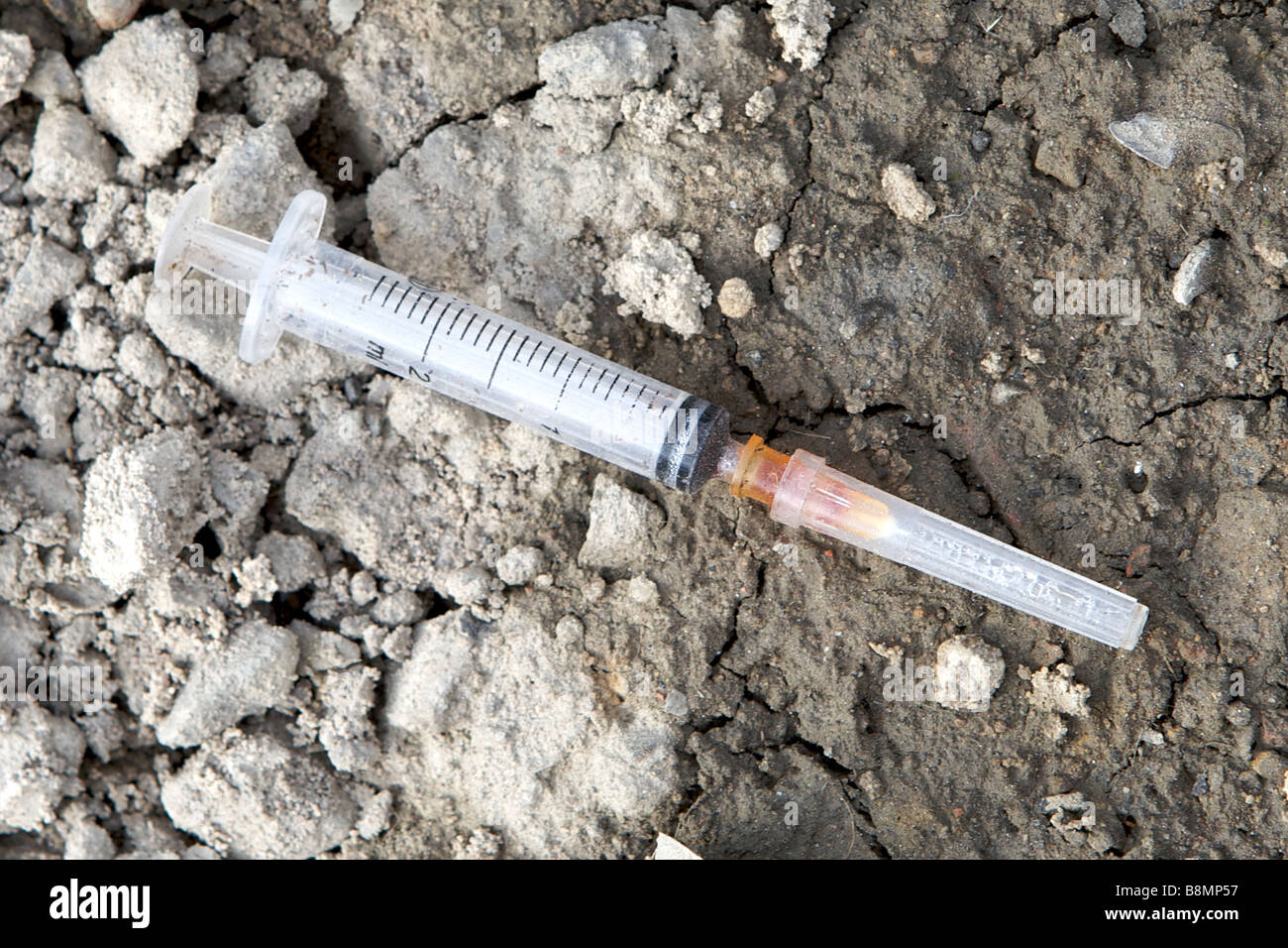 Discarded syringe cover on building hi-res stock photography and images ...