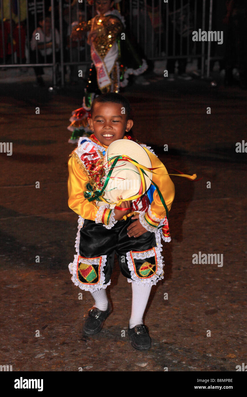 Masked child in the street during the Carnival of Barranquilla ...