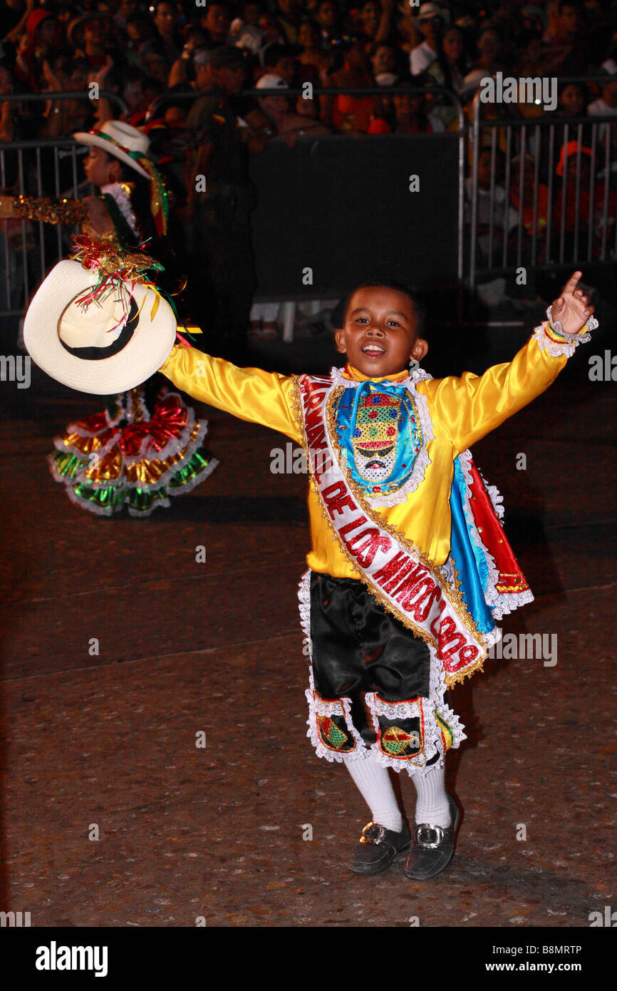 Masked child in the street during the Carnival of Barranquilla ...