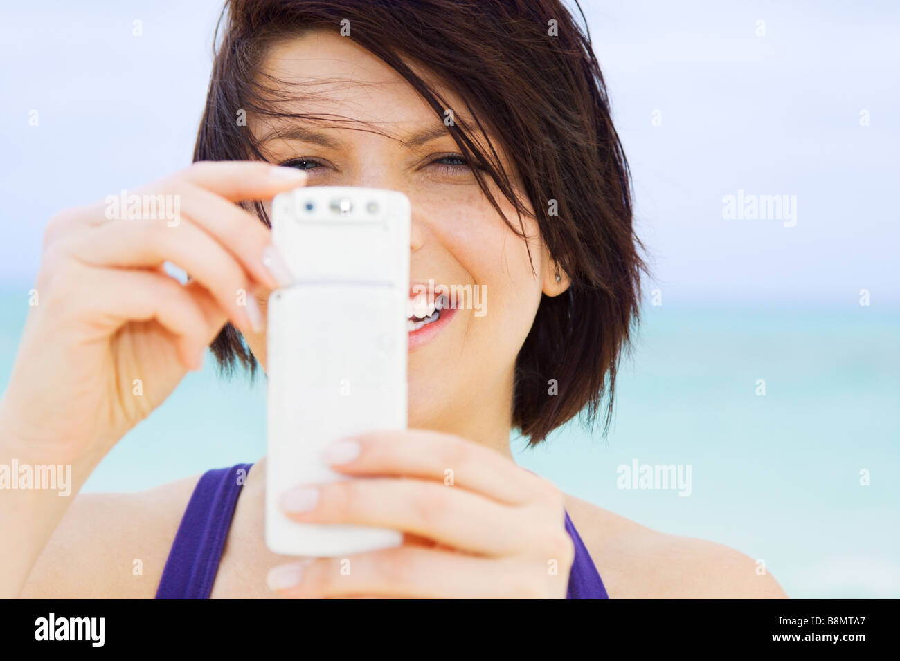 picture of happy woman using phone camera Stock Photo - Alamy