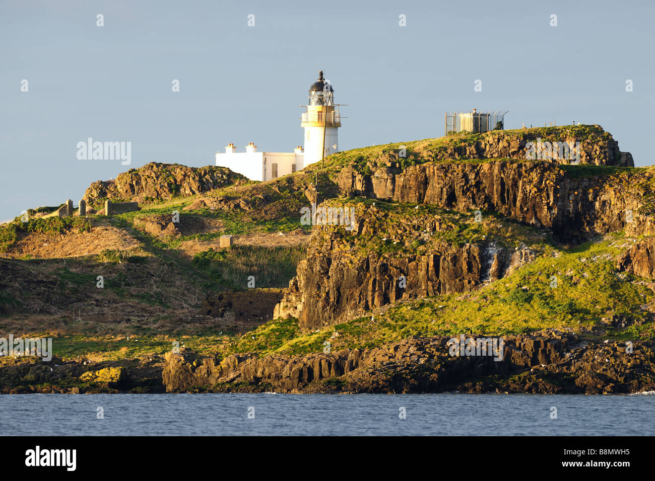 Fidra lighthouse from Yellowcraig beach East Lothian Scotland late on a ...
