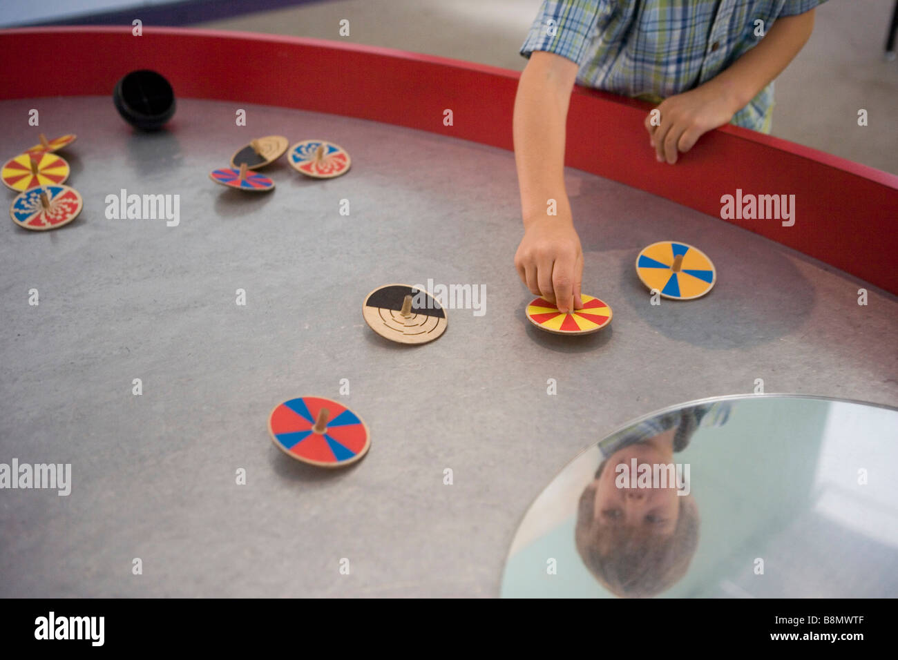 Children playing spinning tops hi-res stock photography and images - Alamy