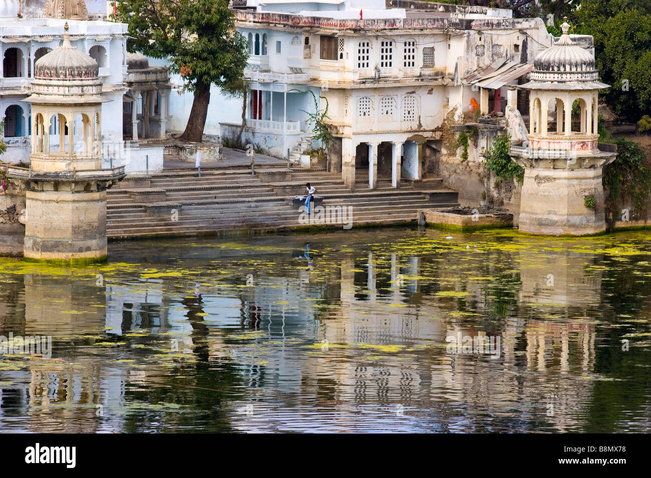 Indian man bathing and washing their clothes Lake Pichola Udaipur ...
