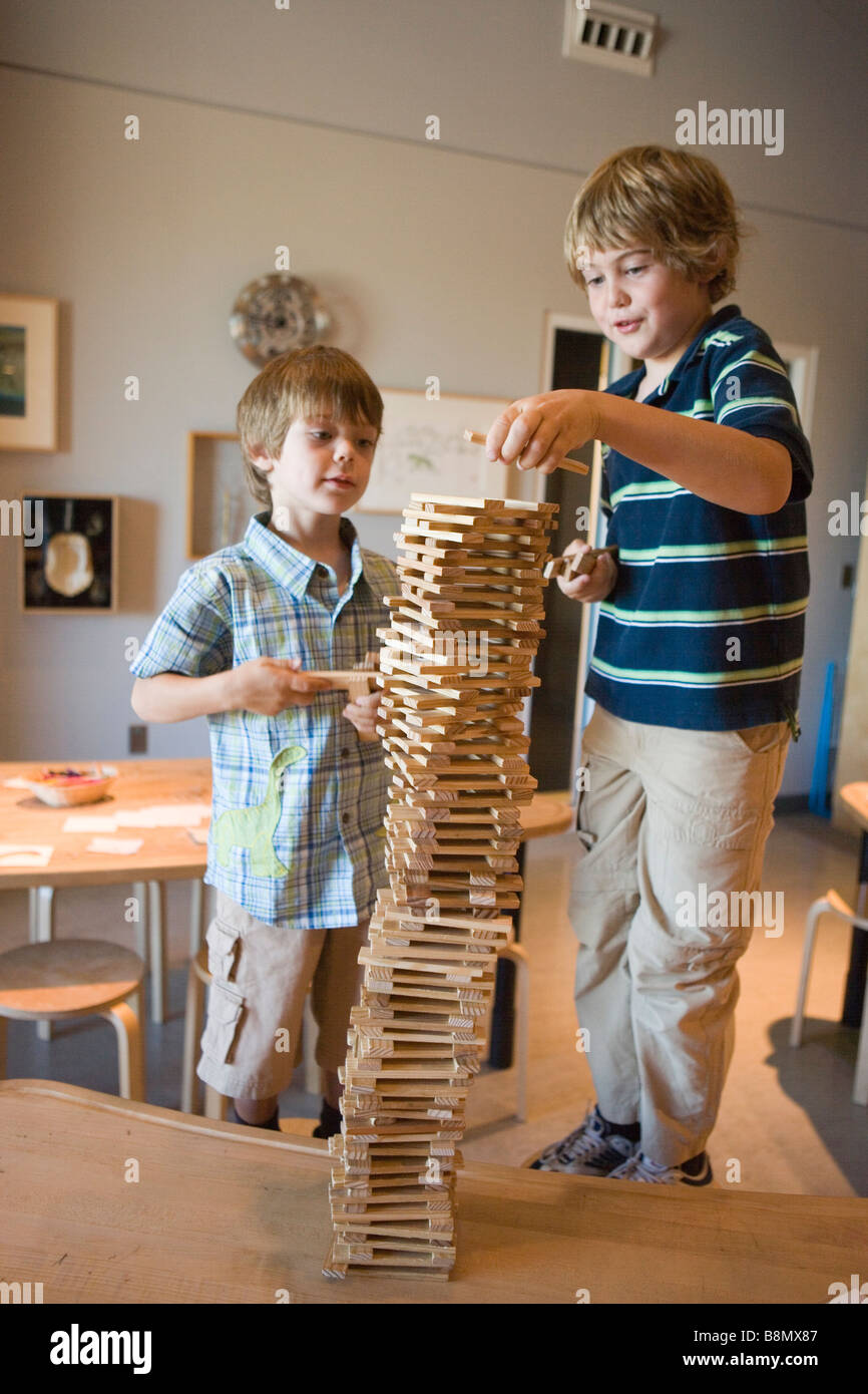 Two boys block tower building hi-res stock photography and images - Alamy