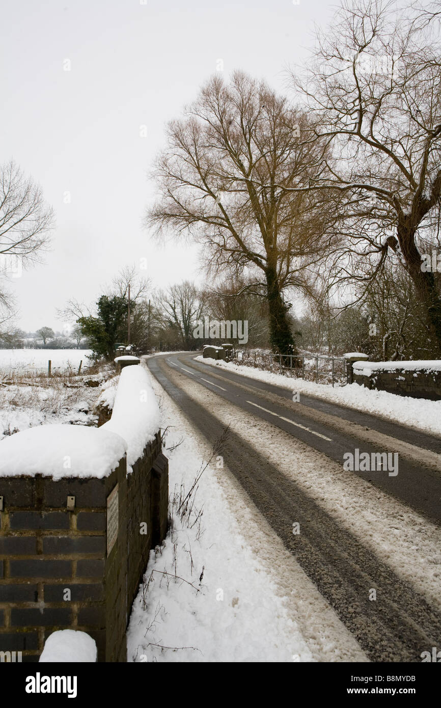 snowy road going over a bridge in Buckinghamshire Stock Photo - Alamy