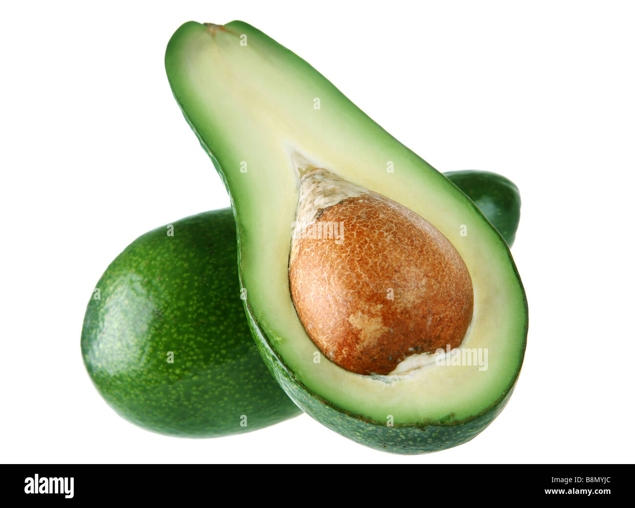 Avocado fruit with slice on white background Stock Photo - Alamy