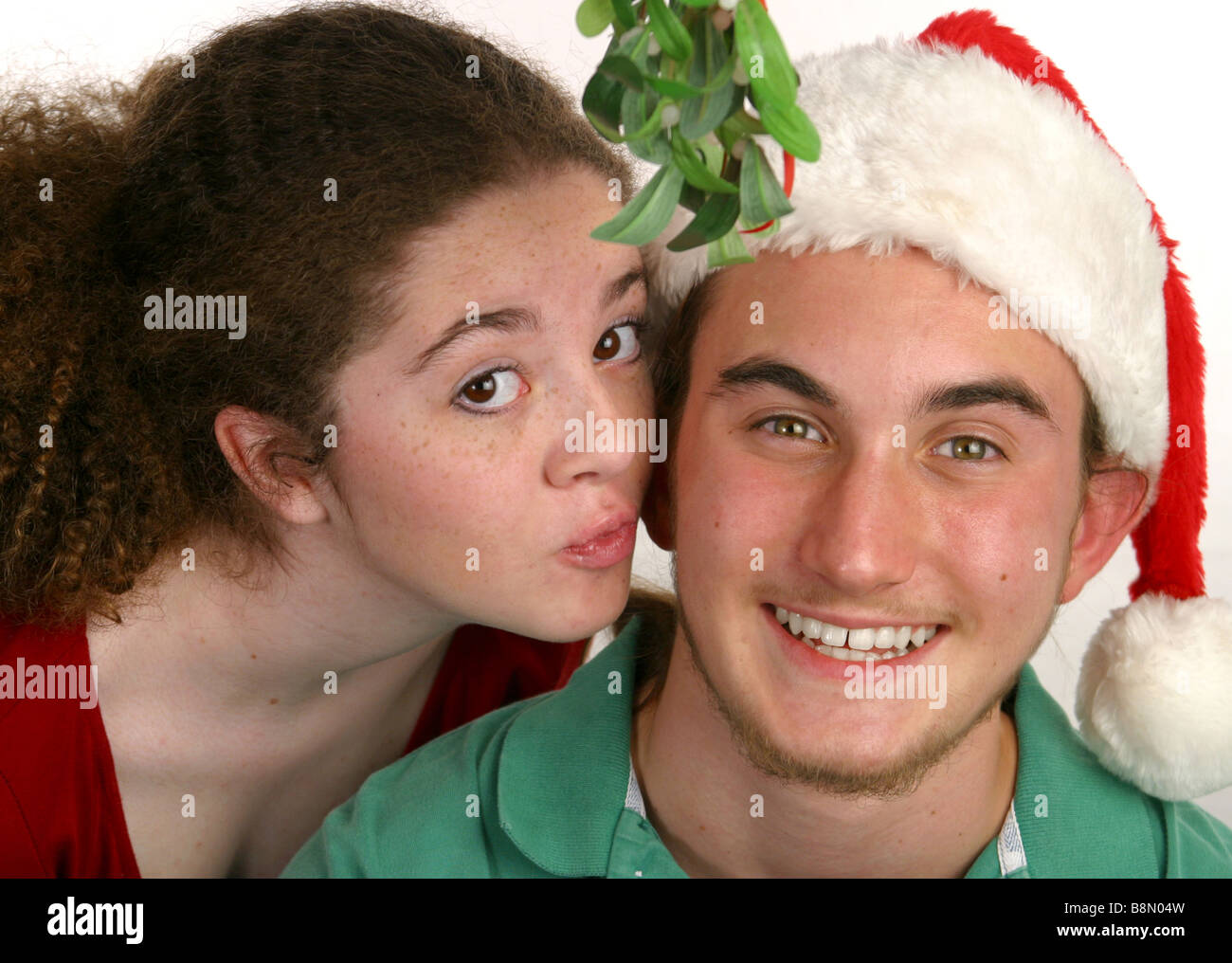 Couple under mistletoe hi-res stock photography and images - Alamy