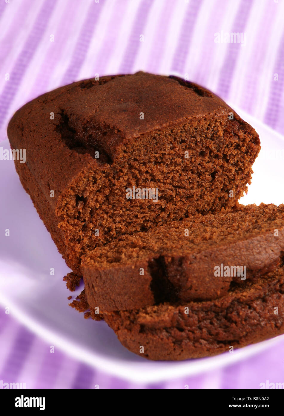 Sweet brown pie focus on slice closeup view Stock Photo - Alamy