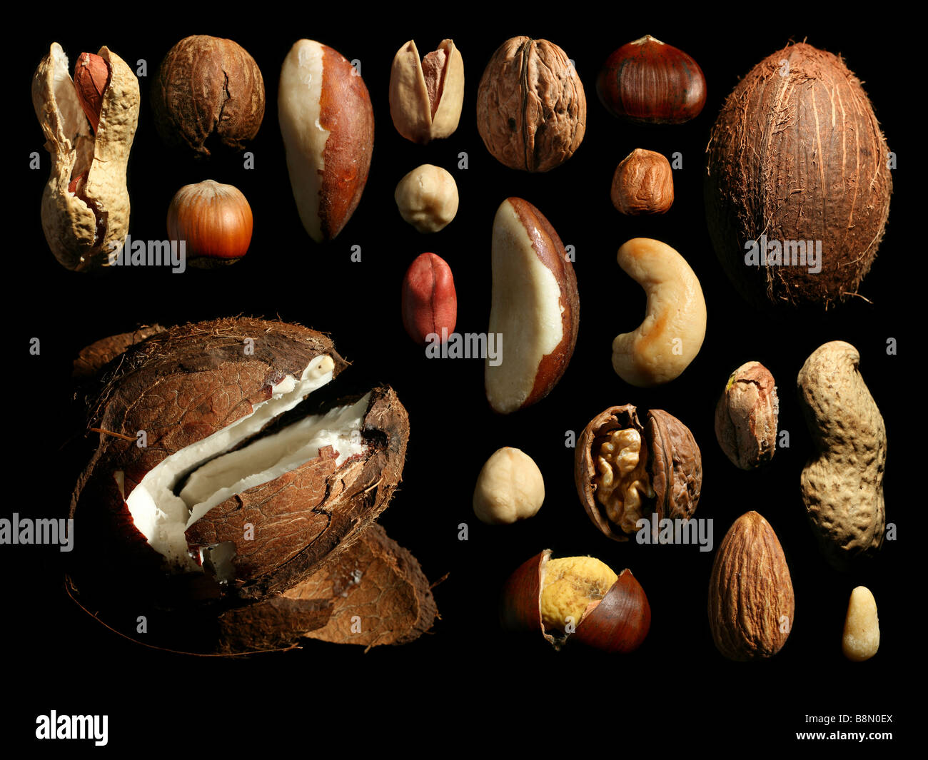 Set nut fruit on black in dark light Stock Photo - Alamy