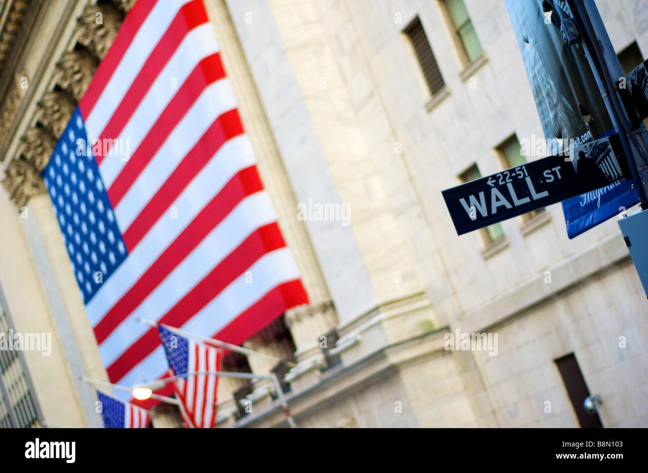 Wall Street Sign with American Flag Draped Over New York Stock Exchange ...