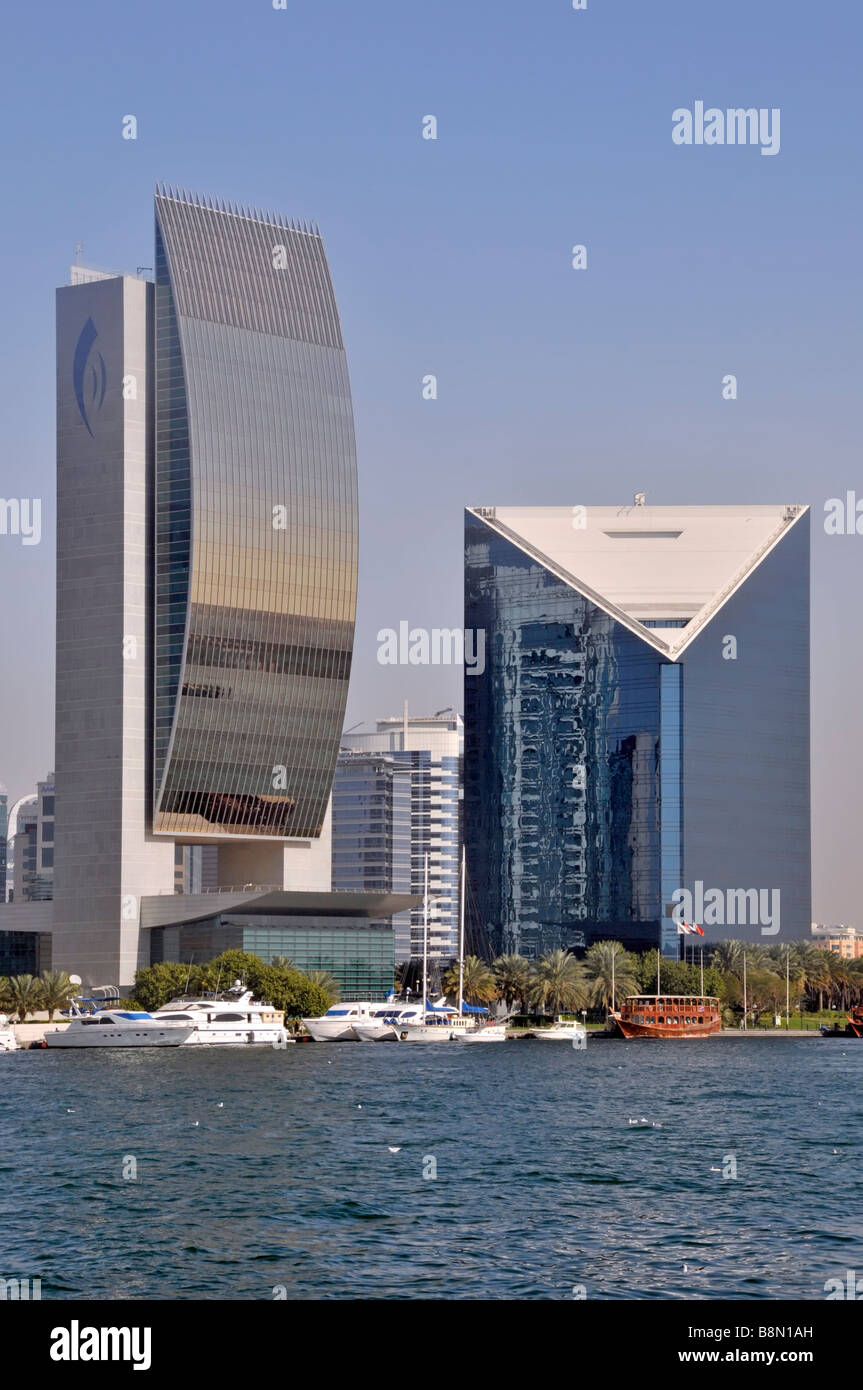 Dubai Creek and modern building architecture skyline includes curved ...