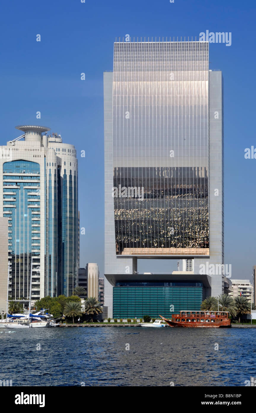 Dubai Creek and modern building architecture skyline includes curved ...