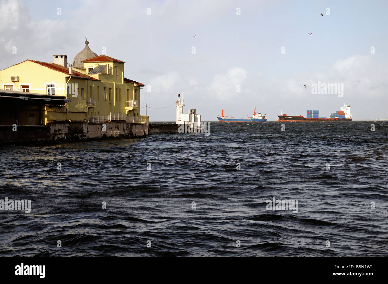 Cargo ships shipping bulk haulage along the Kordon promenade esplande ...