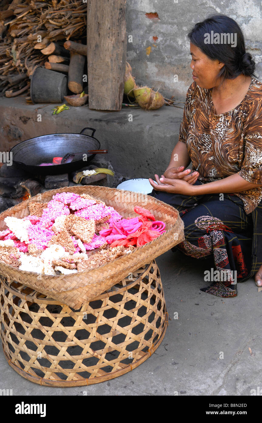 Bali aga woman cooking cryspy for praying during Galungan festival,Bali ...