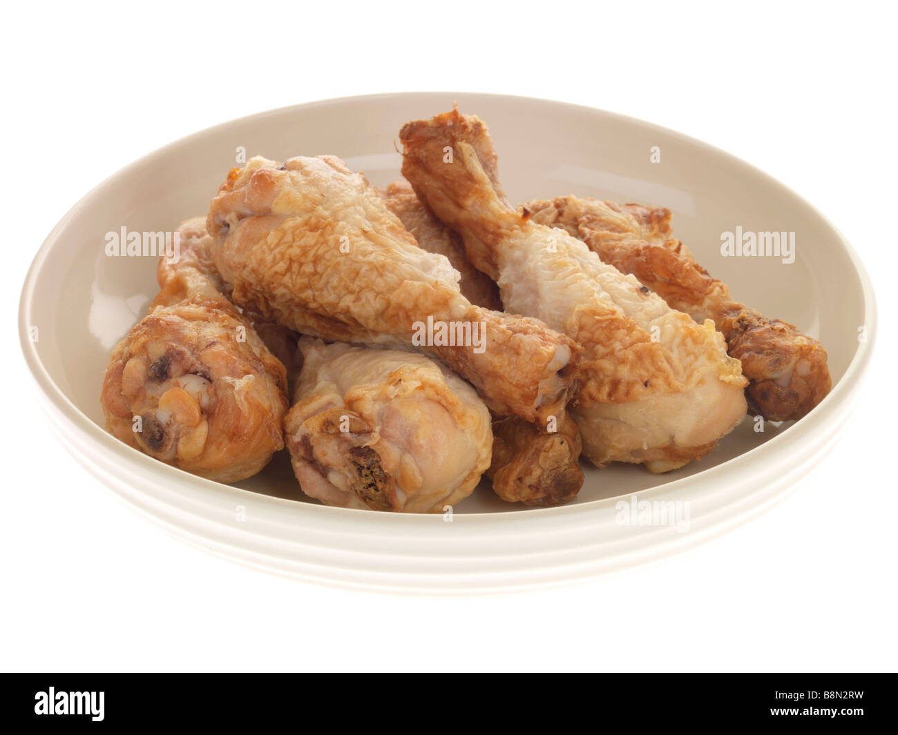 Cooked Tender Succulent Cold Chicken Legs Or Drumsticks Against A White ...