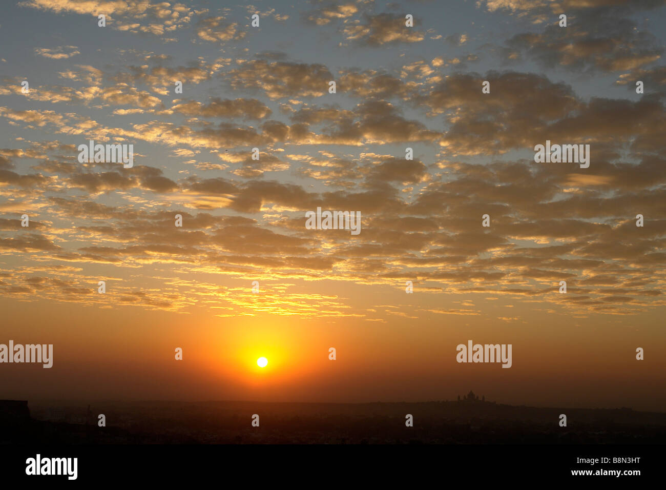 indian sunrise and backlit clouds from the jodhpur fort Stock Photo - Alamy