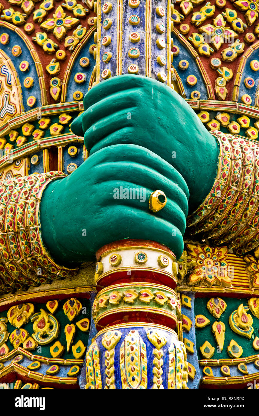 A detail picture of the hands of a temple guard at the Grand Palace ...