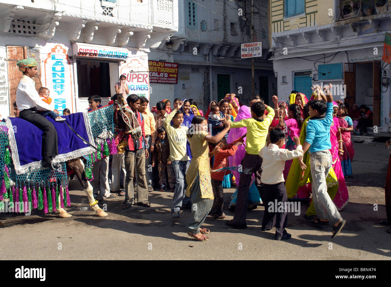 puja ceremony and traditional indian dancing in the back streets of ...