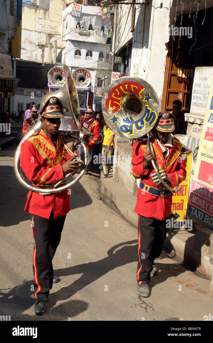 traditional indian brass band walking through the streets of udaipur ...