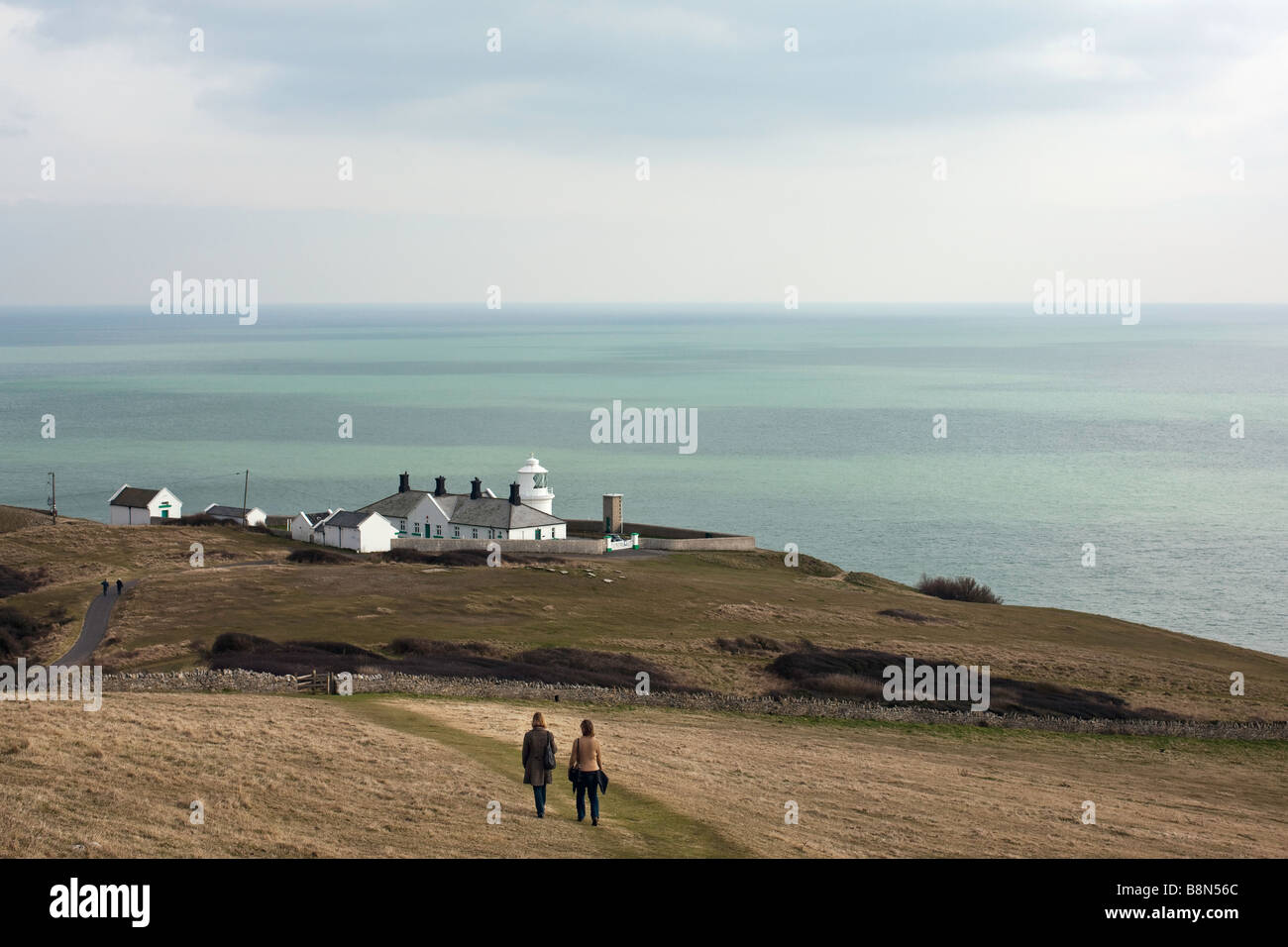 Two Couples Walking to Anvil Point Lighthouse on Coastal Path Stock ...