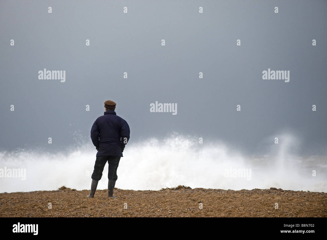 North sea sea rough weather storm person man cley norfolk hi-res stock ...
