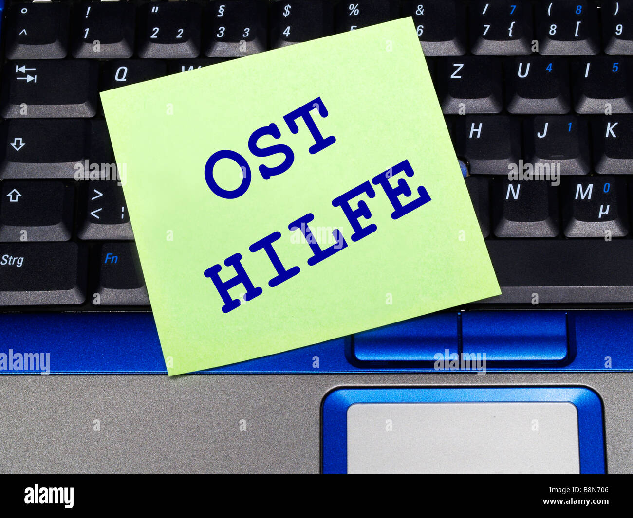 memo note on notebook, help for East Stock Photo - Alamy