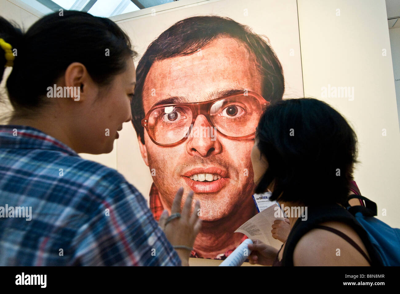 Visitors viewing a large portrait painting at the Metropolitan Museum ...