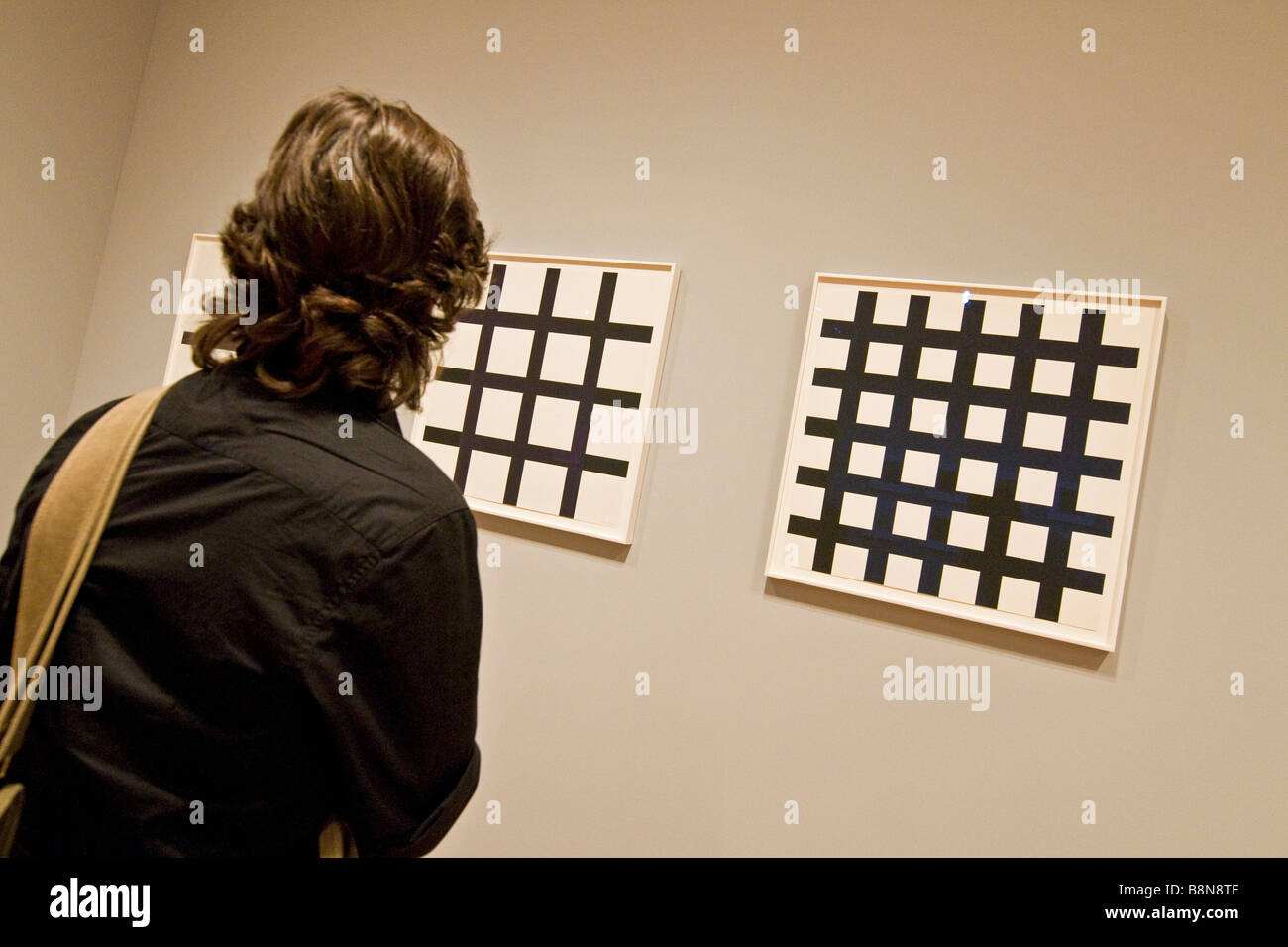Visitor viewing an exhibit at the Museum of modern art Stock Photo - Alamy