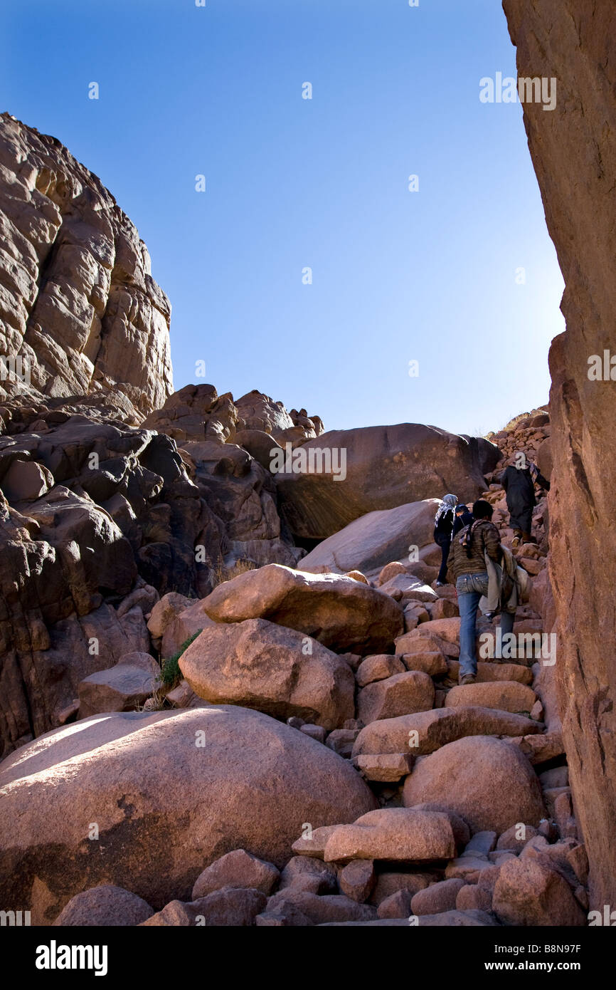 guides climbing up ahead mount Sinai, the mount of God, Sinai, Egypt ...