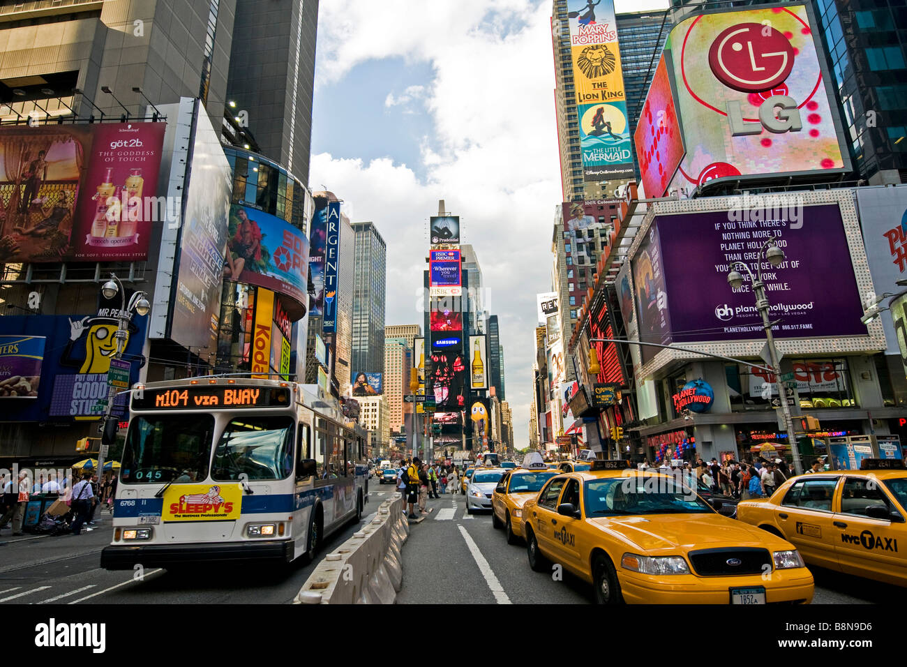 Times square crowded with traffic, busses, signage and people Stock ...