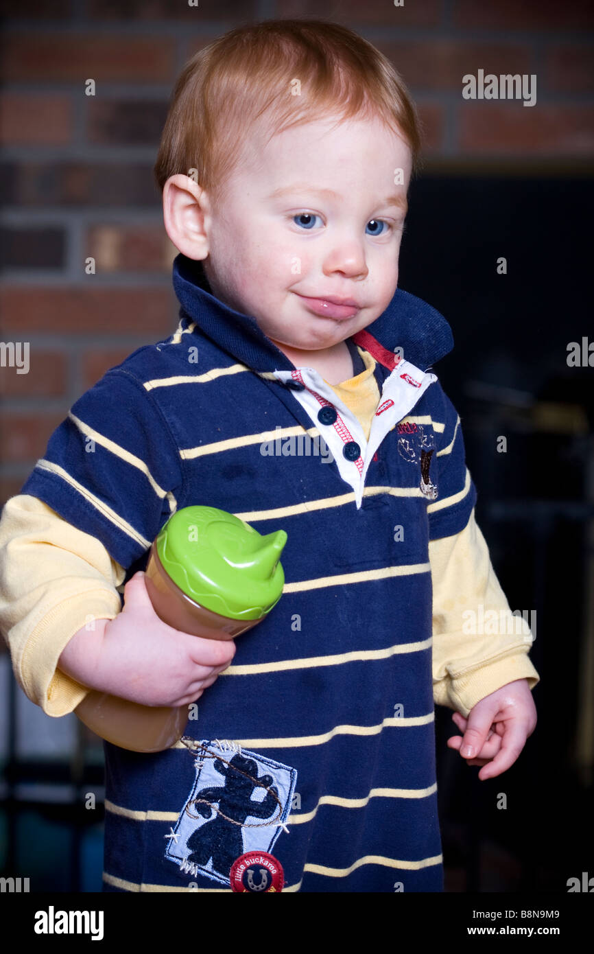 Toddler holding sippy cup hi-res stock photography and images - Alamy