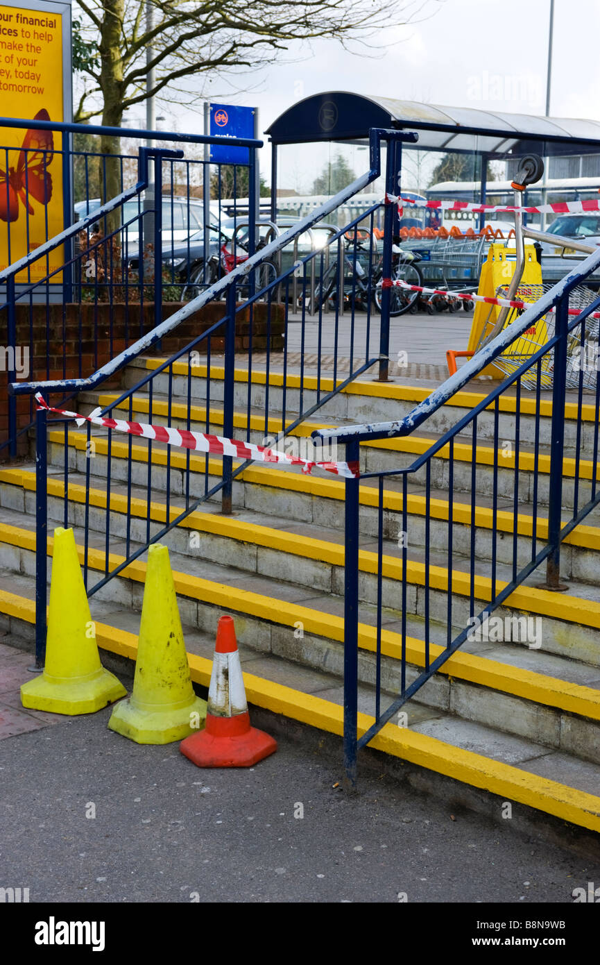 traffic cones and tape no access to supermarket steps Stock Photo - Alamy