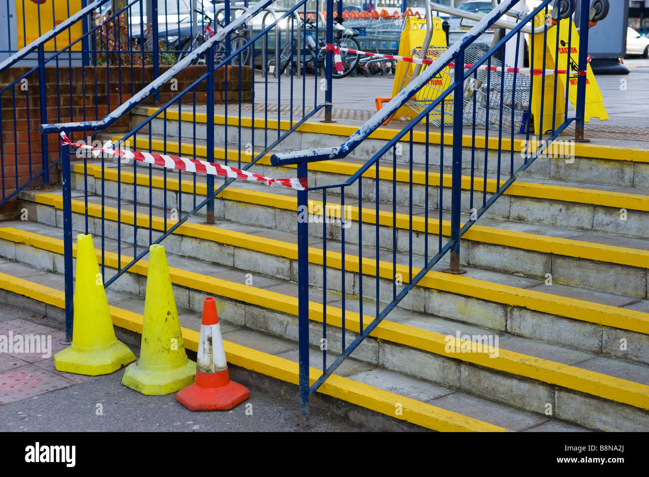 traffic cones and tape no access to supermarket steps Stock Photo - Alamy